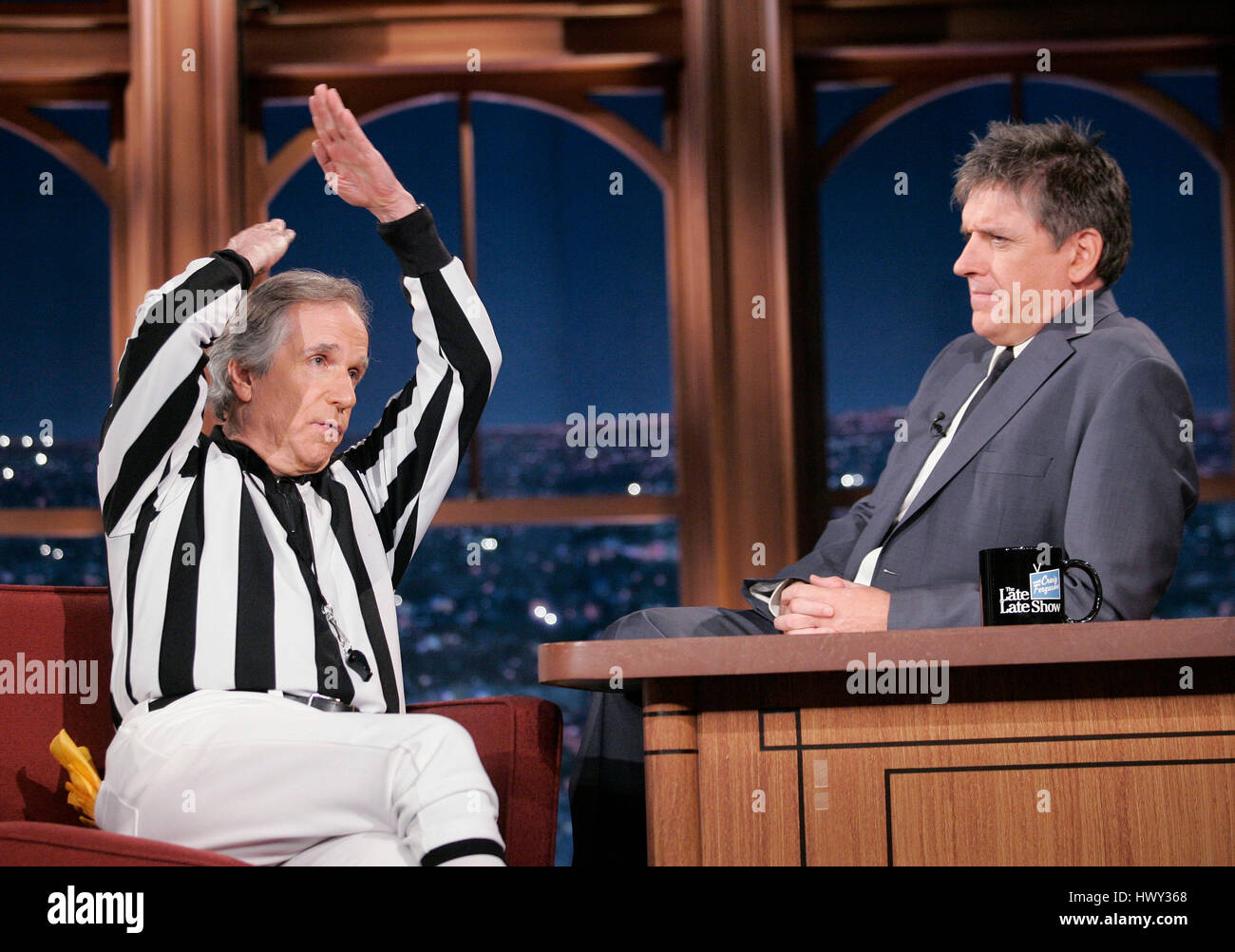 Actor Henry Winkler with a football referee uniform, left, with host ...