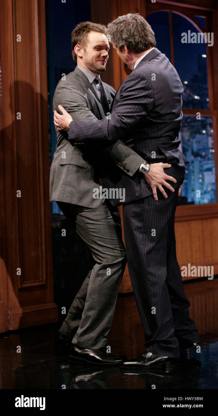 Comic Joel McHale, left, hugs host Craig Ferguson during a segment of ...