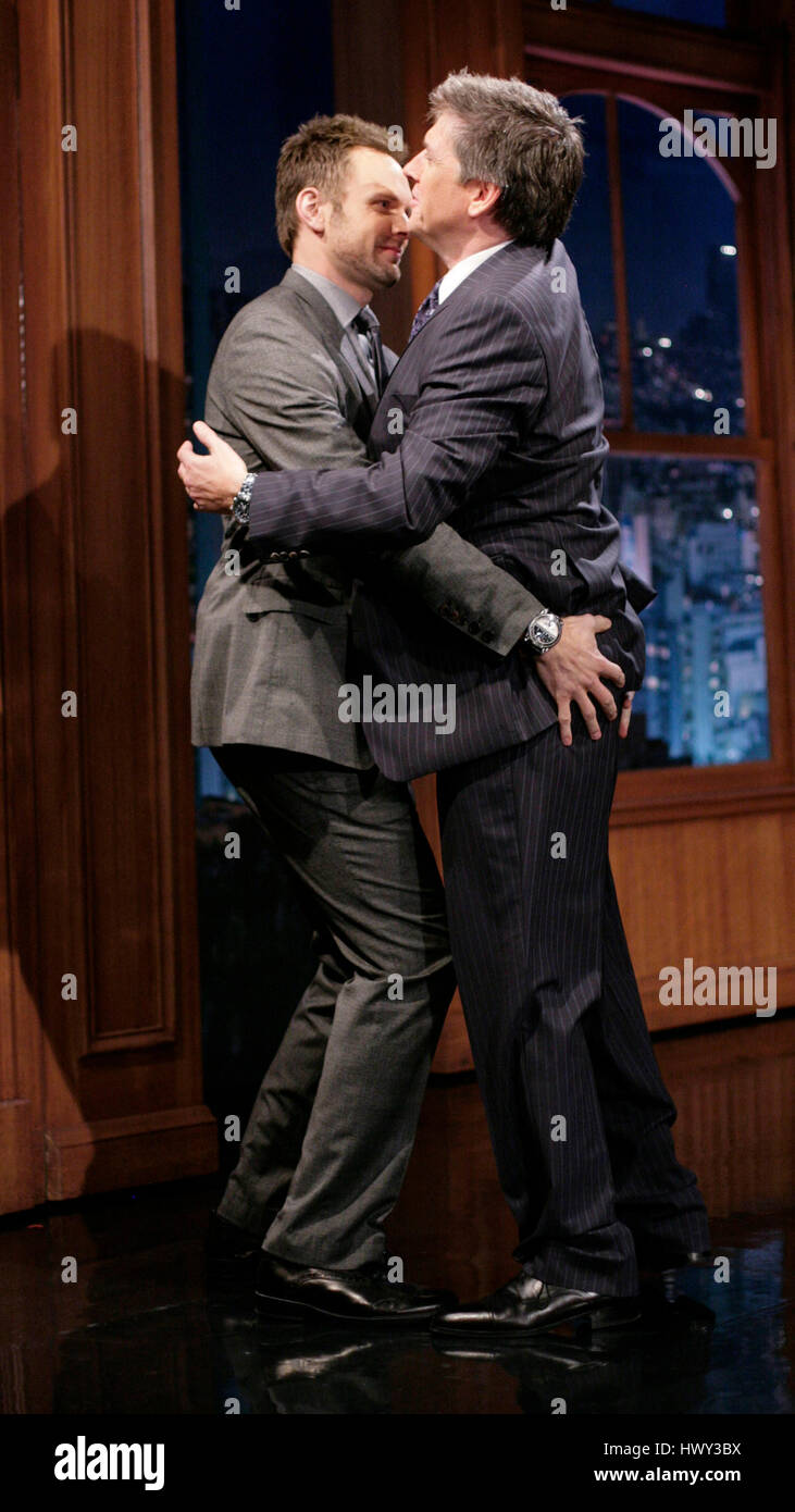 Comic Joel McHale, left, hugs host Craig Ferguson during a segment of ...