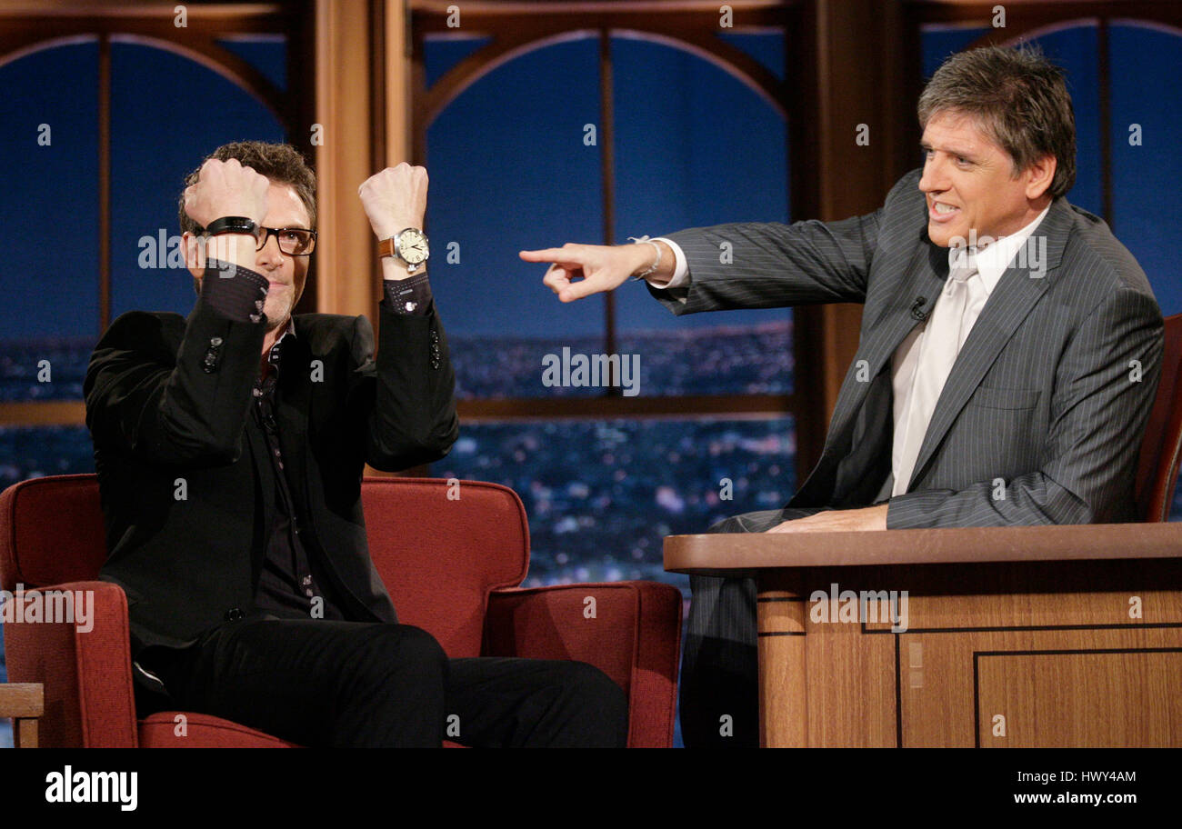 Actor Tim Daly, left, shows off his two watches to host Craig Ferguson ...