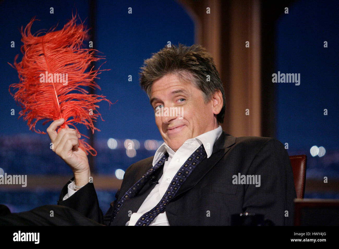 Host Craig Ferguson holds a feather during a segment of 'The Late Late ...