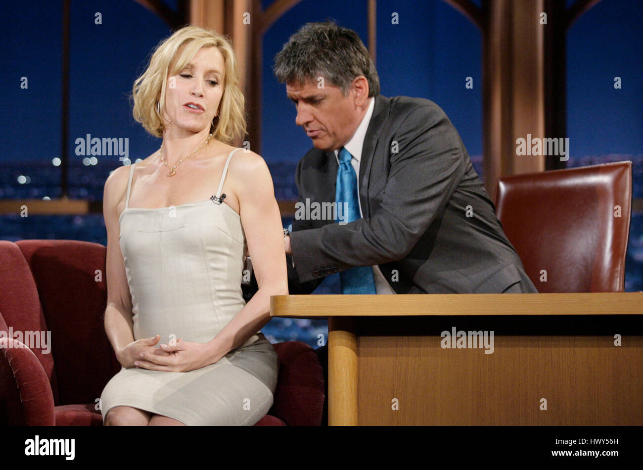 Actress Felicity Huffman, left, has her microphone pack adjusted by ...