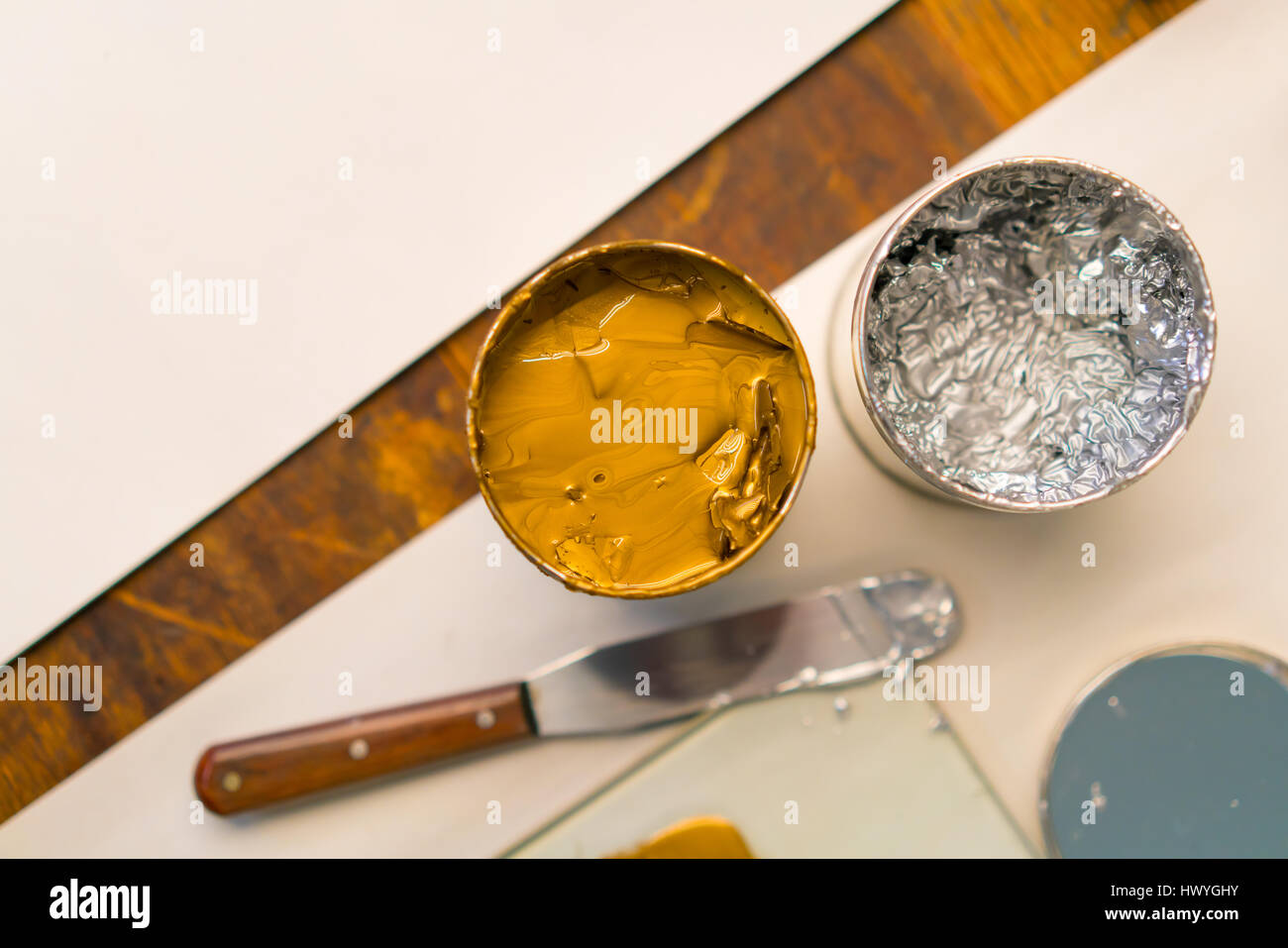 Oil based ink in cans on a table in a printing studio Stock Photo - Alamy
