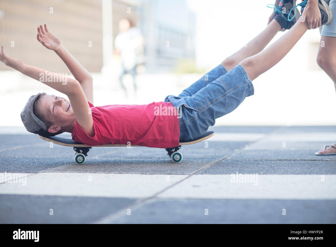 Kids skateboarding in the street Stock Photo - Alamy