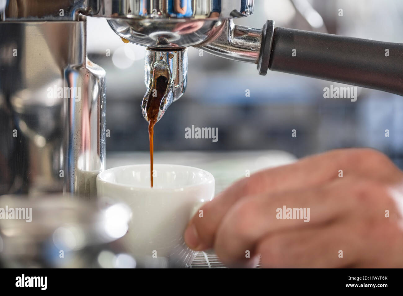 Barista using espresso machine Stock Photo - Alamy