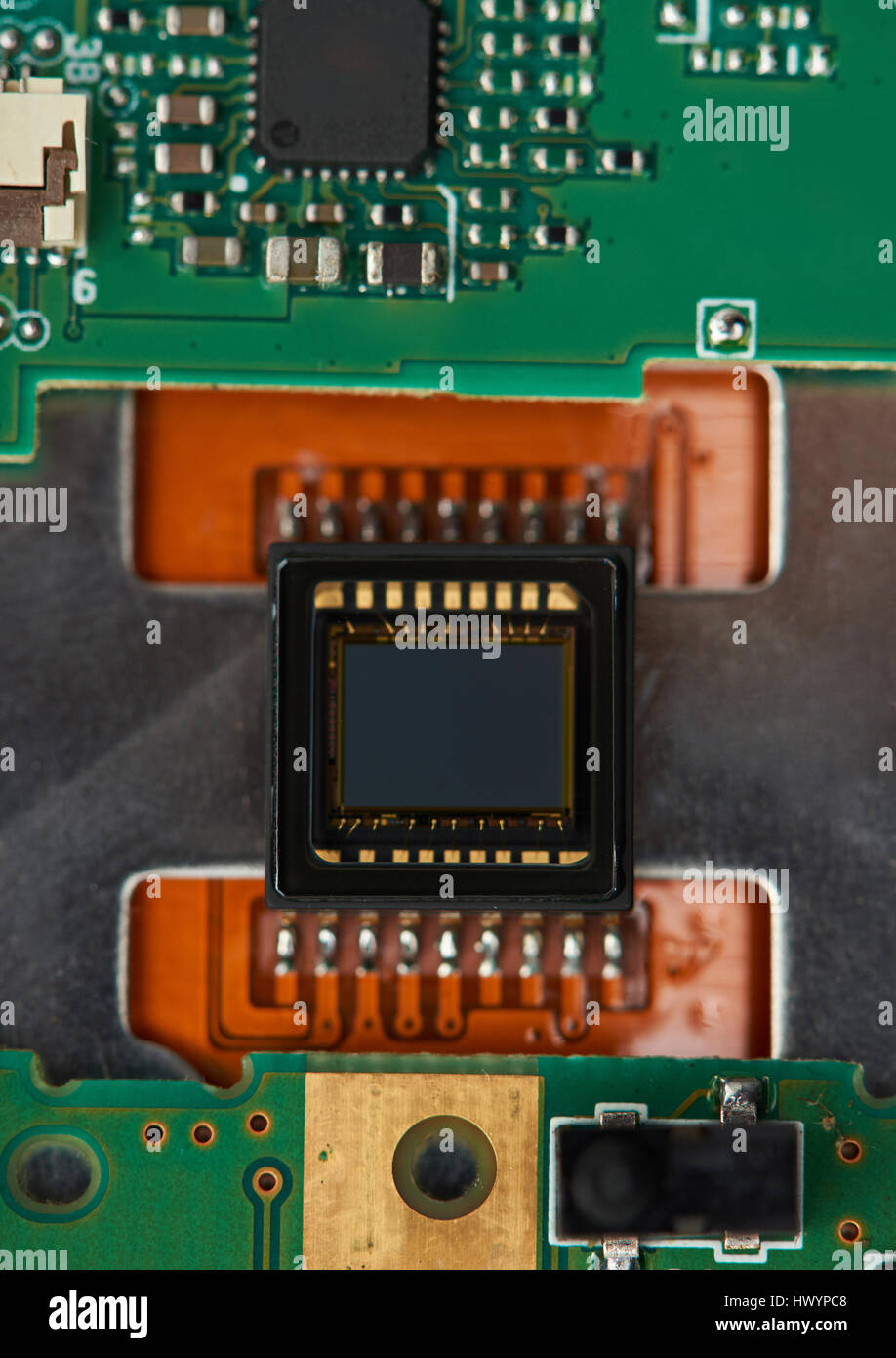 Camera sensor with microchip green background. Small electronic circuit ...