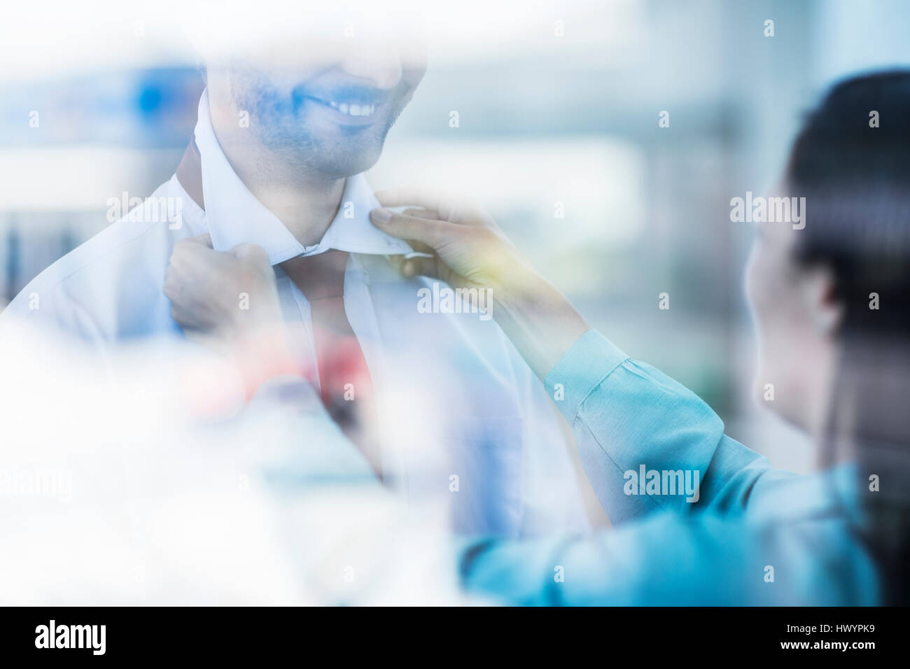 Woman binding man tie hi-res stock photography and images - Alamy