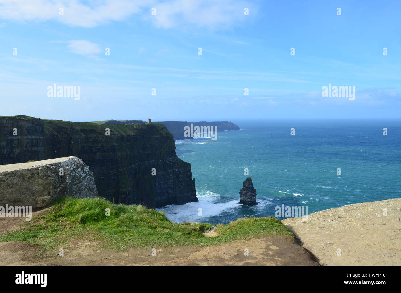 Ireland's needle rock formation with blue skies on the Cliff's of Moher ...