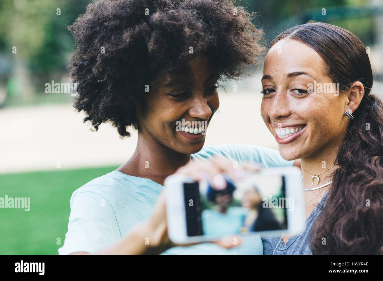 Portrait of two best friends taking selfie in a park Stock Photo - Alamy