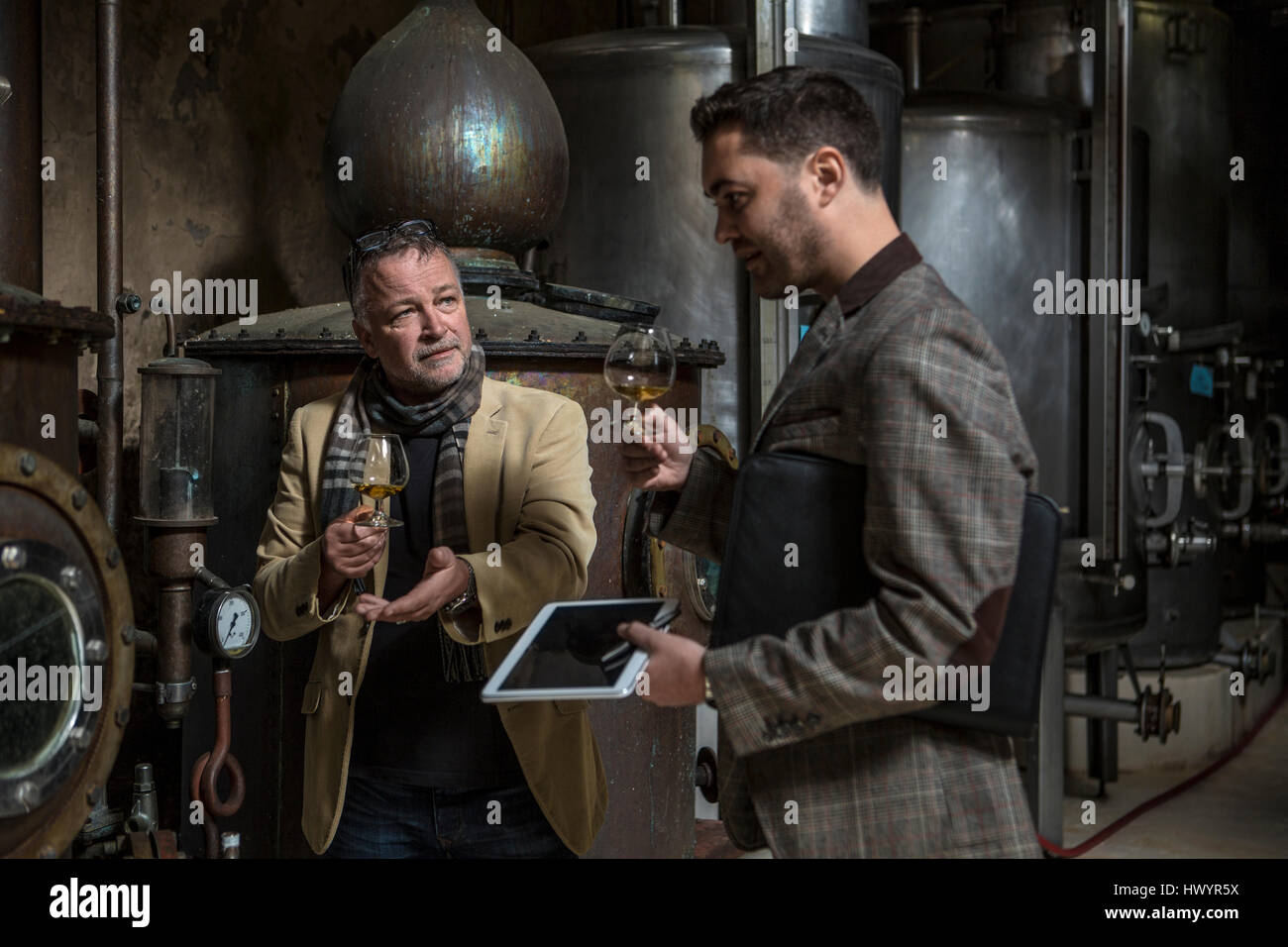 People in distillery tasing whiskey Stock Photo - Alamy