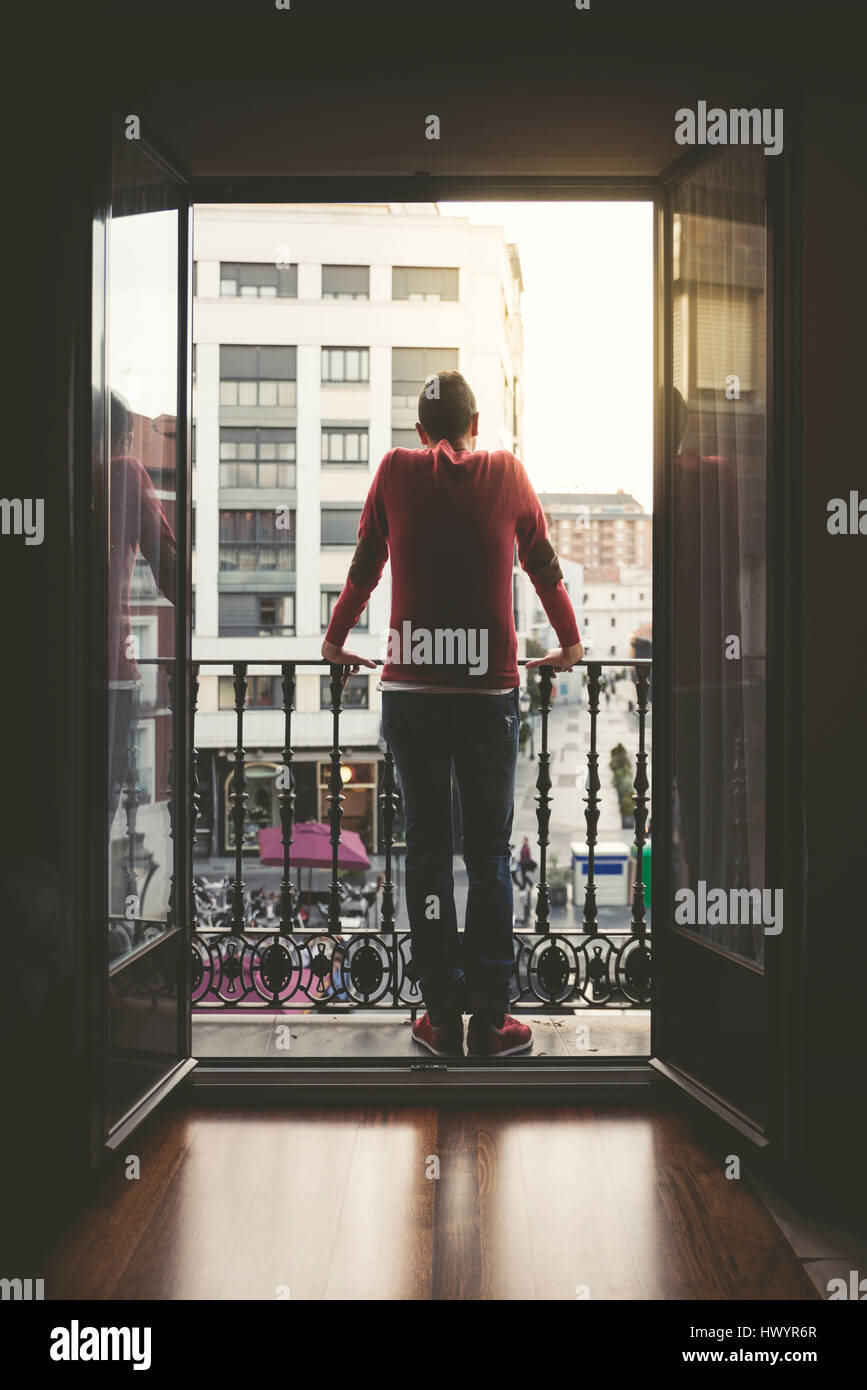 Person standing on balcony high rise hi-res stock photography and ...