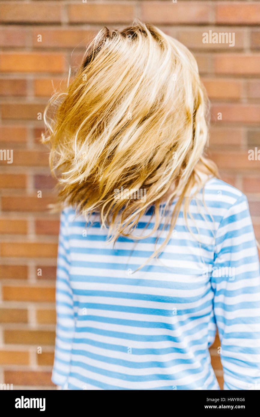 Young woman tossing her hair Stock Photo - Alamy