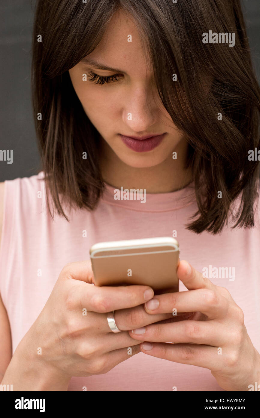 Young woman text messaging Stock Photo - Alamy