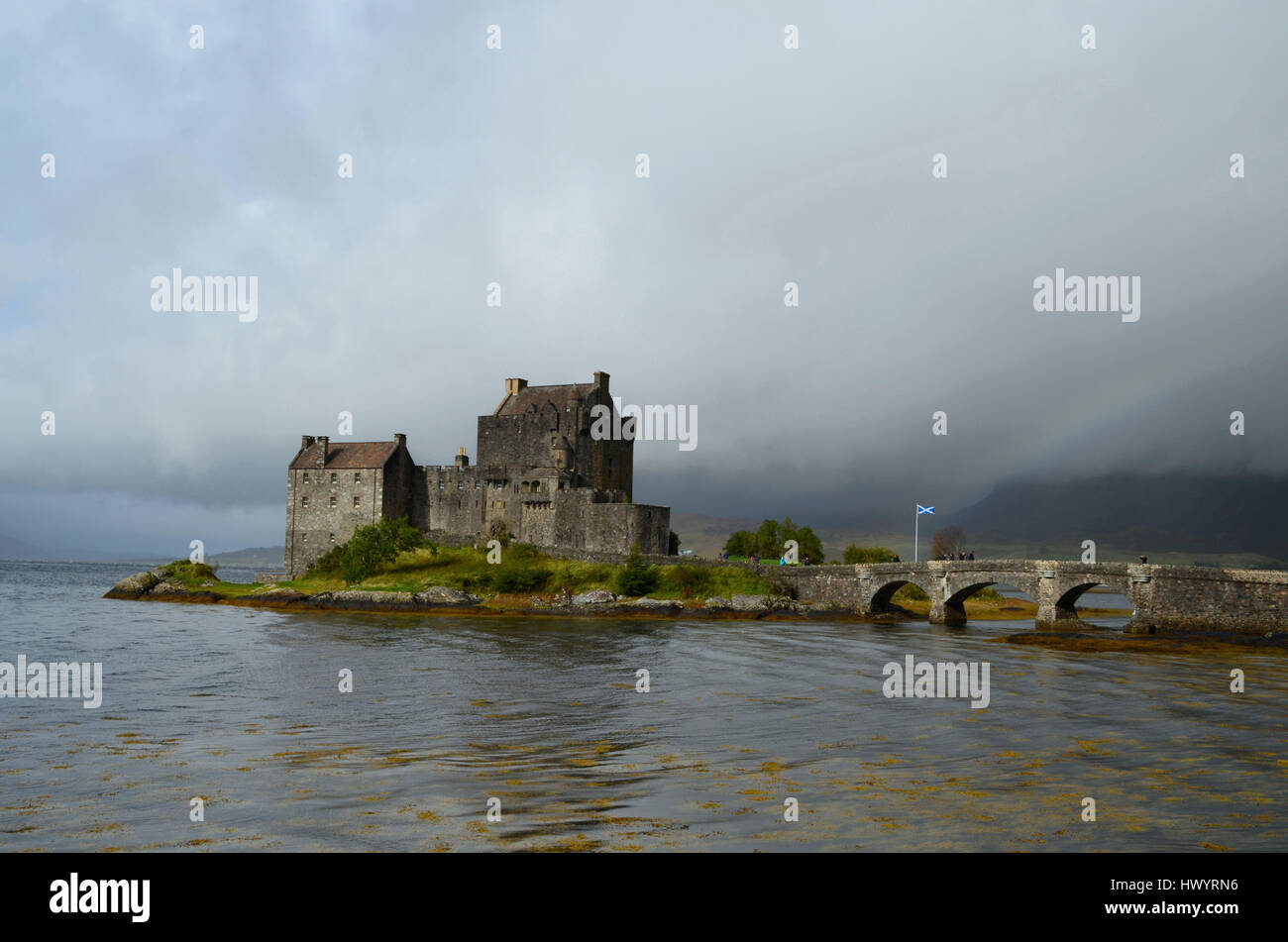 Scottish flag flying over Eilean Donan Castle on Loch Duich Stock Photo ...
