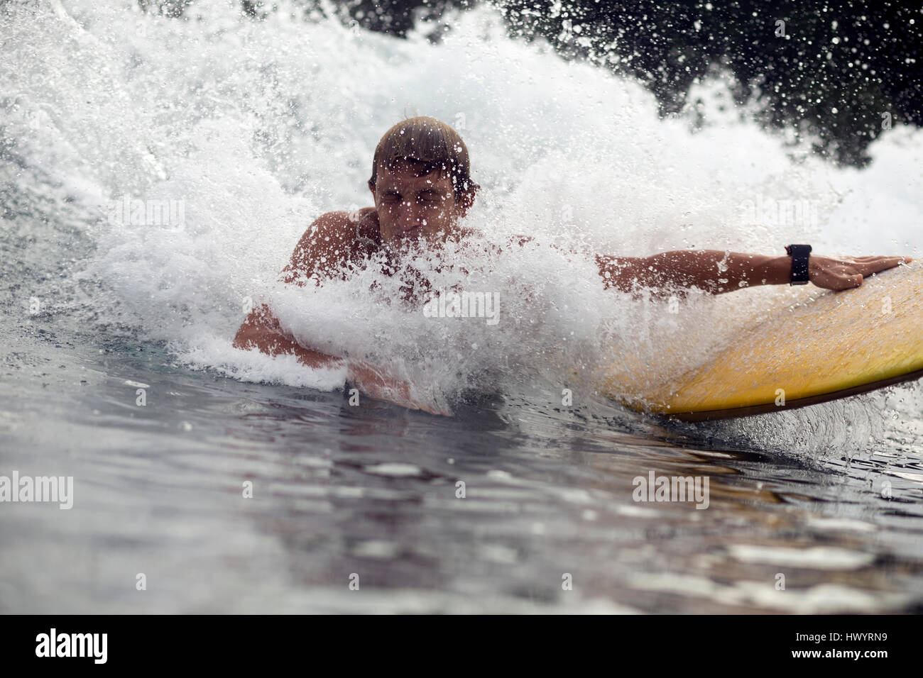 Indonesia, Java, water splashing over man surfing Stock Photo - Alamy