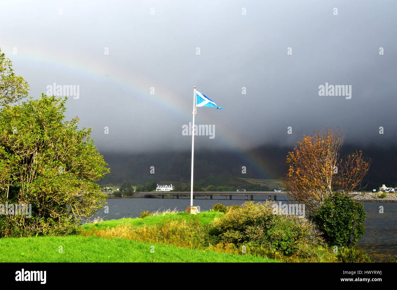 Scottish flag flying above Eilean Donan Castle Stock Photo - Alamy