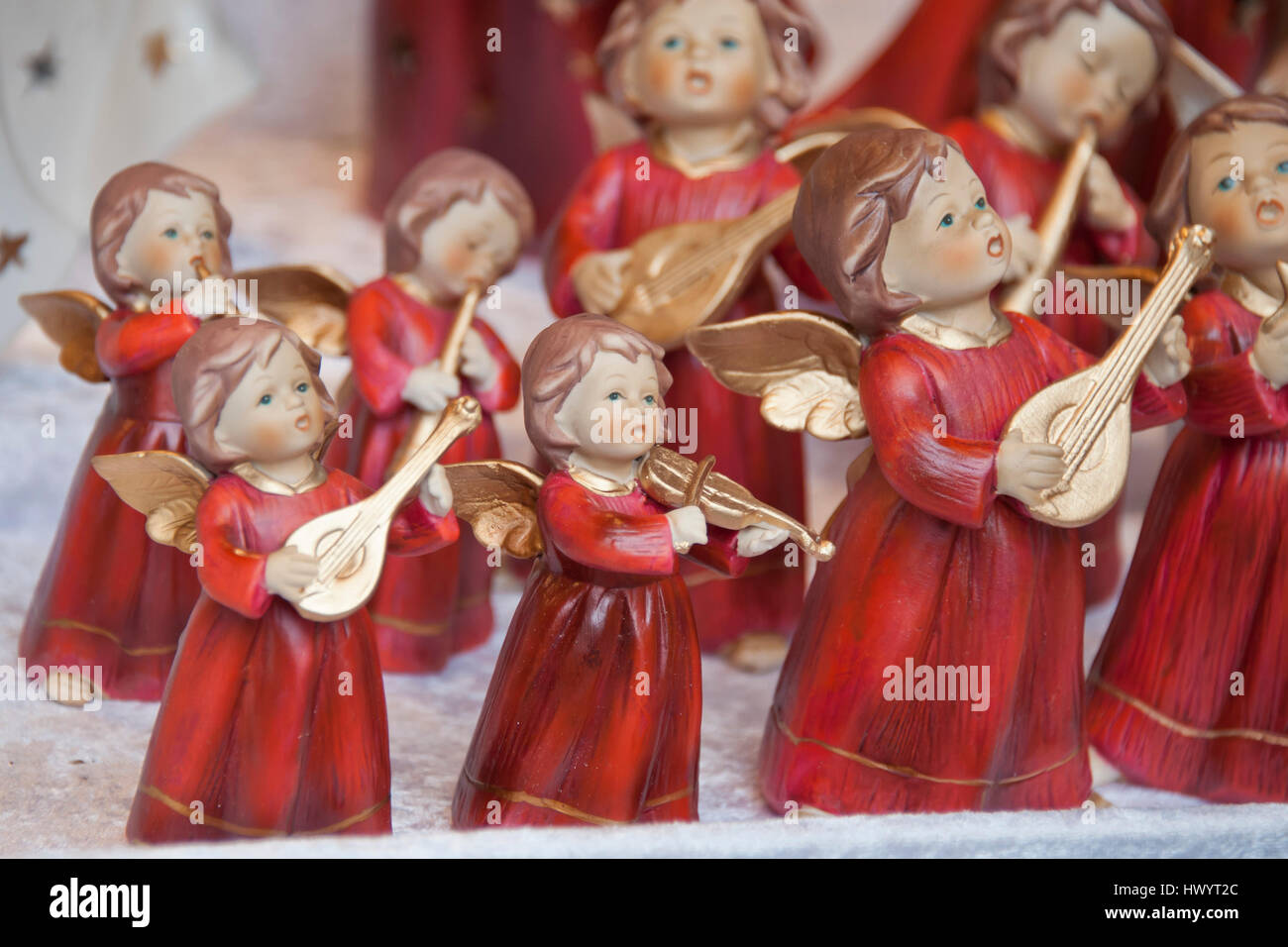 christmas angels in red dressed playing instruments Stock Photo - Alamy