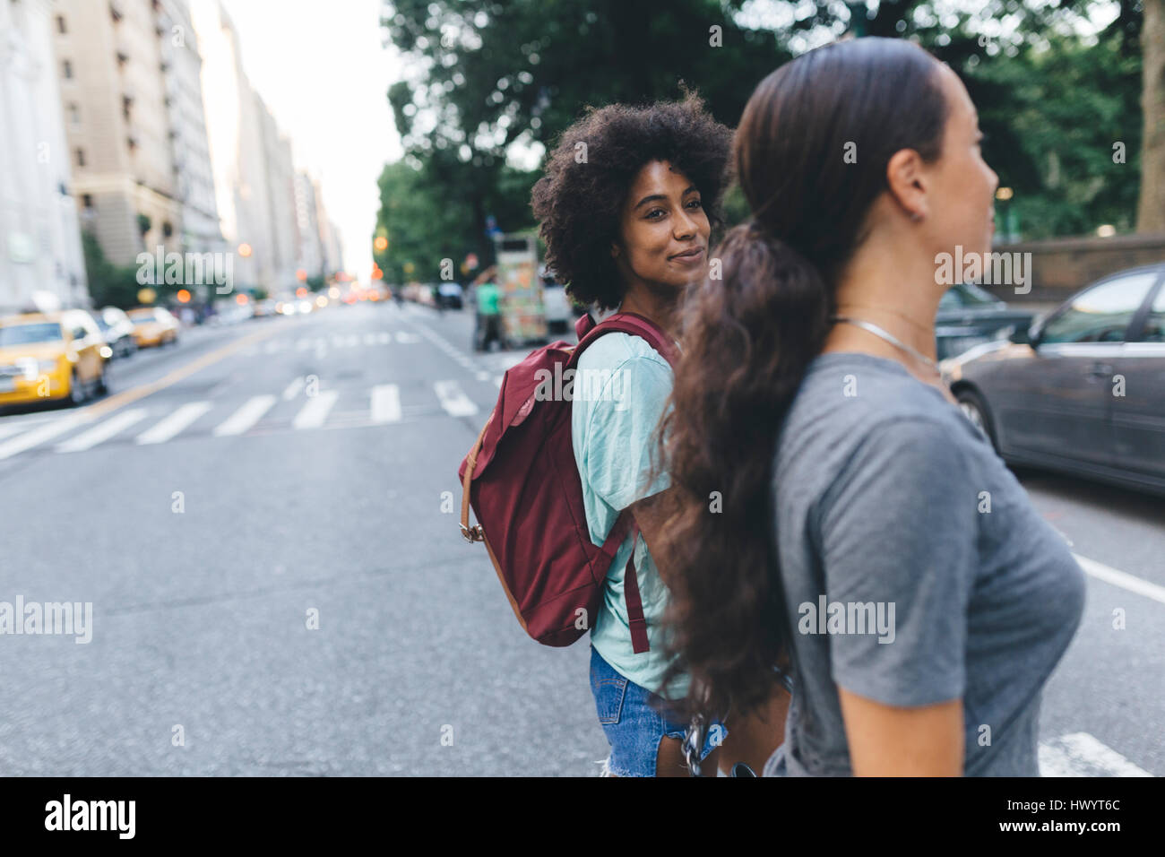 Two friends crossing the street hi-res stock photography and images - Alamy