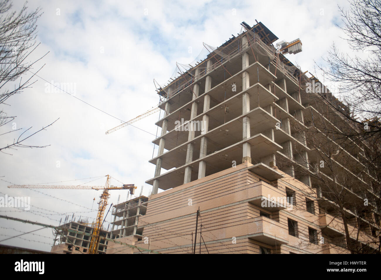 The construction of multi-storey housing building Stock Photo - Alamy