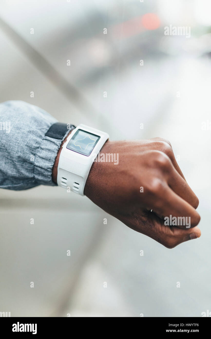 Close-up of athlete wearing smartwatch Stock Photo - Alamy
