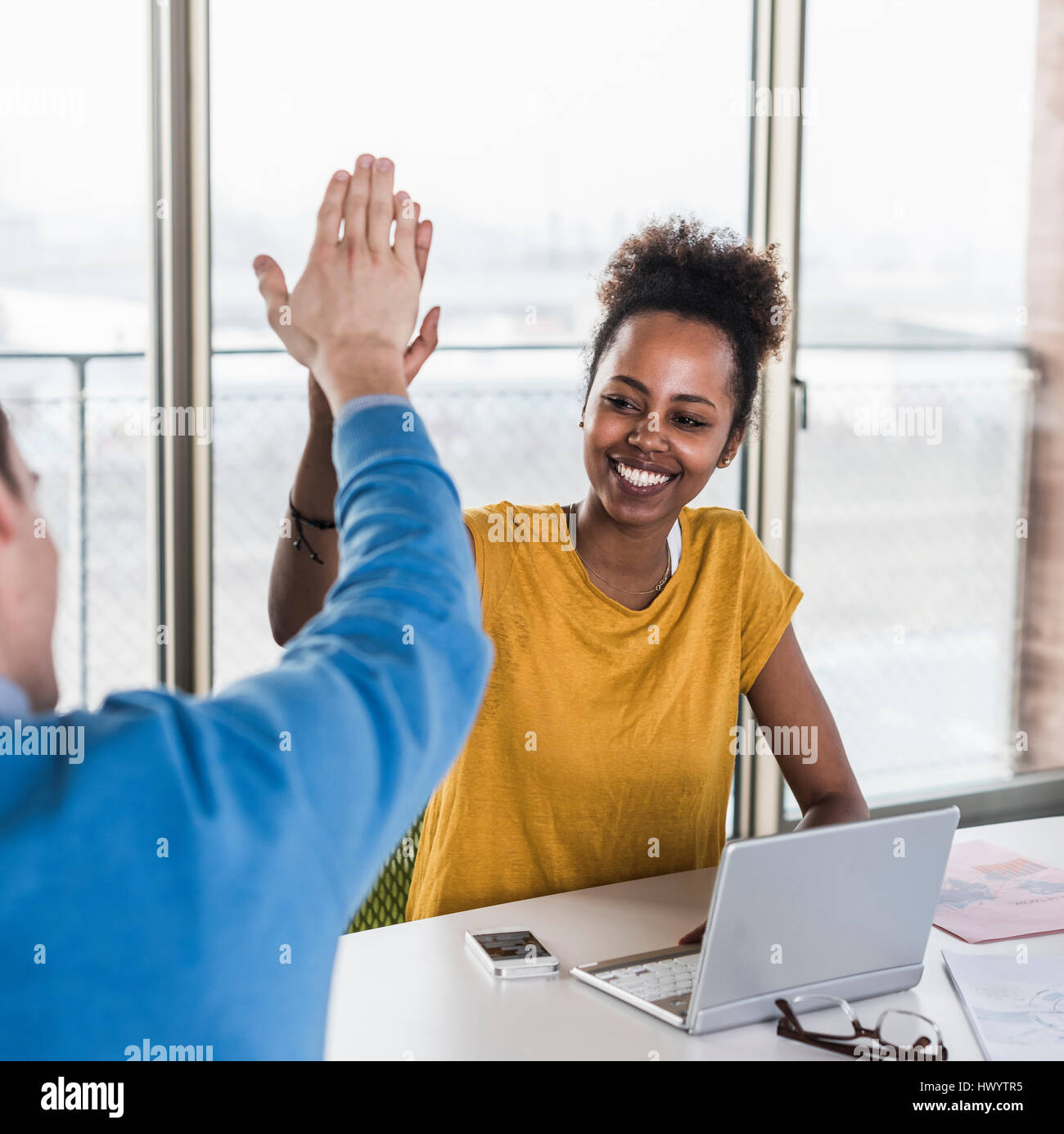 Businessman businesswoman cheering high fiving hi-res stock photography ...