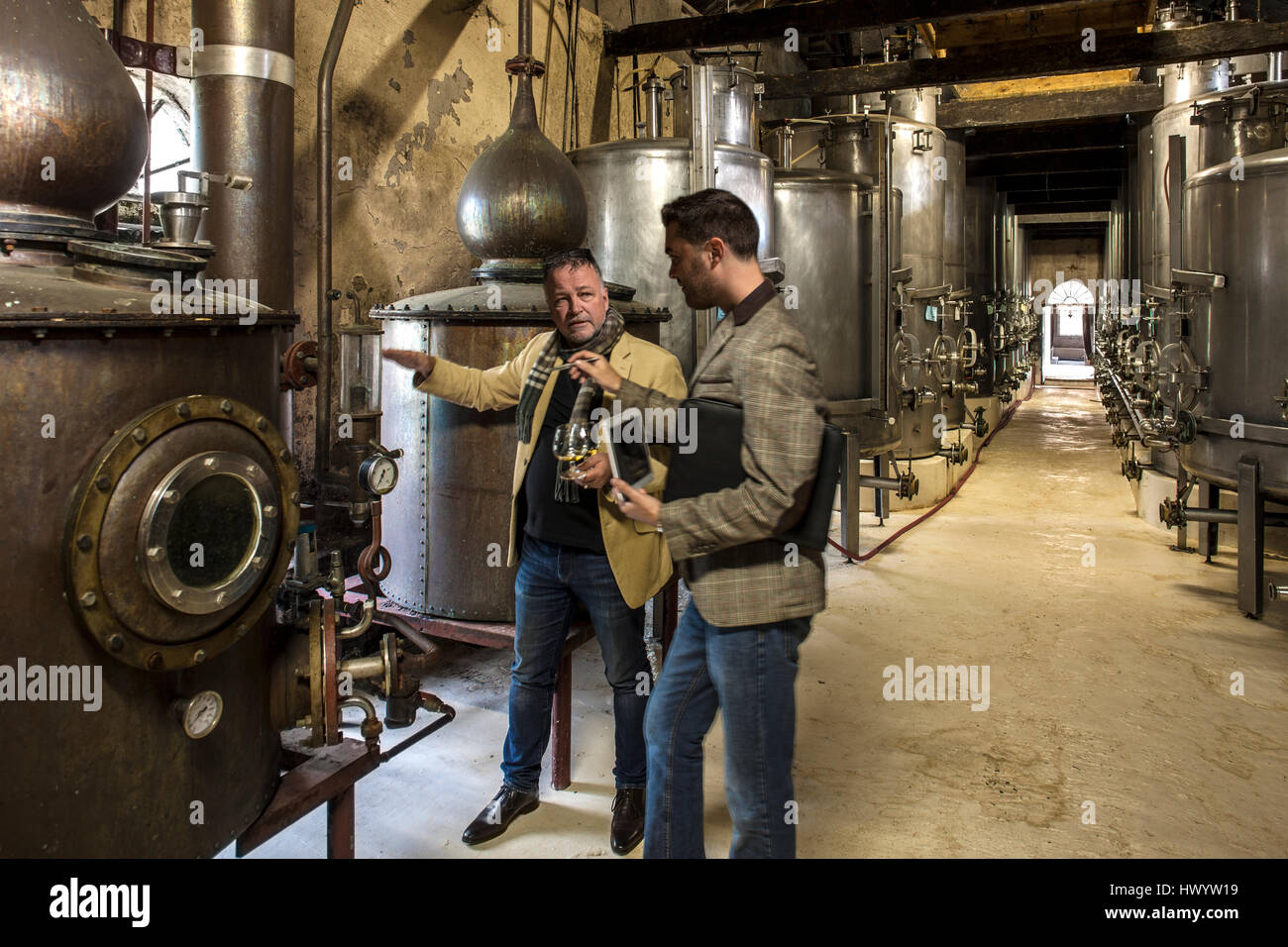 People in distillery tasing whiskey Stock Photo - Alamy