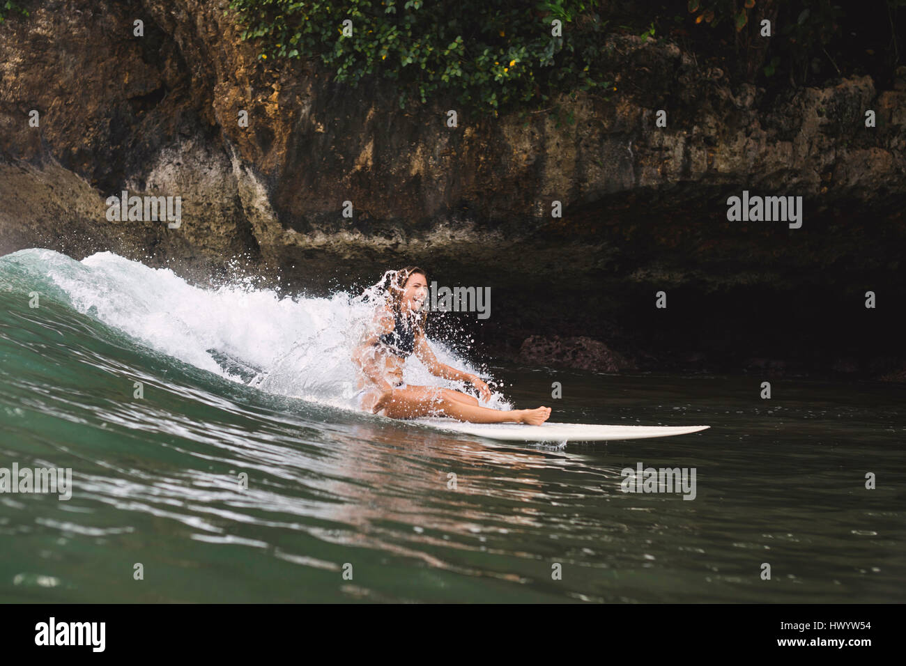 Indonesia, Java, happy woman surfing Stock Photo - Alamy
