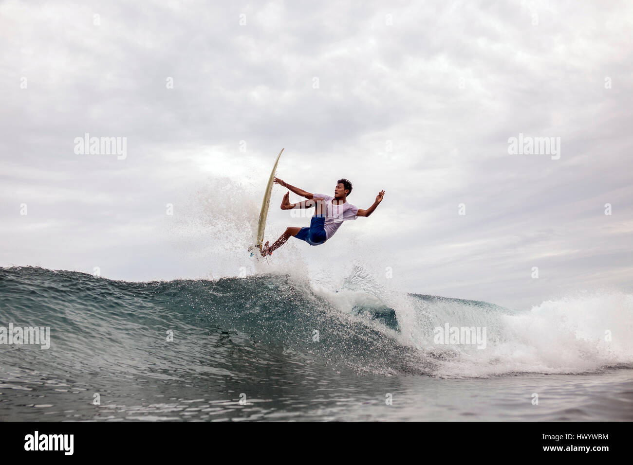 Asian Man Surfing Ocean High Resolution Stock Photography and Images ...