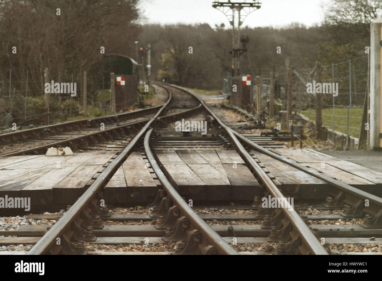 View down the middle of train tracks Stock Photo - Alamy