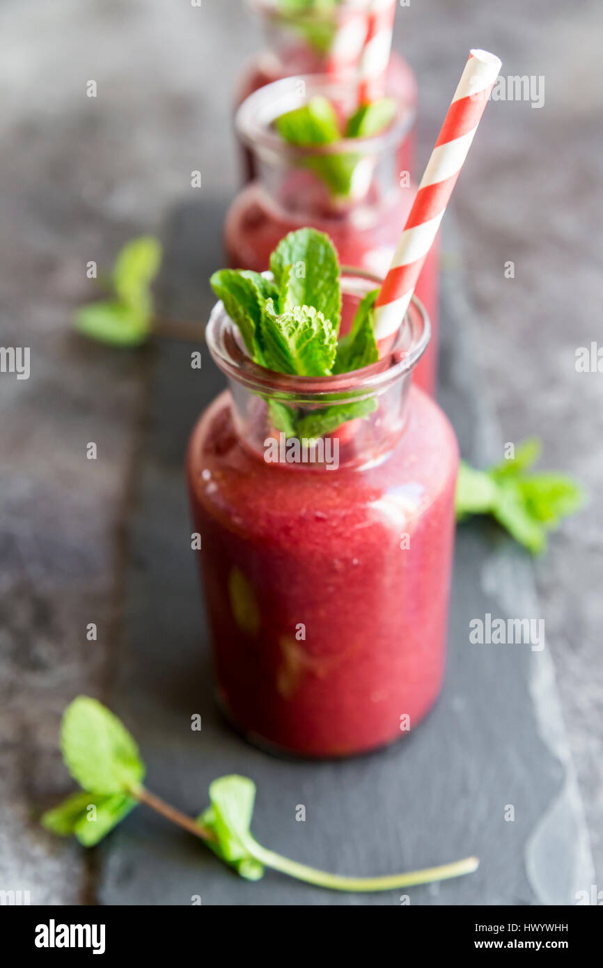 Beet root smoothie in glasses garnished with fresh mint Stock Photo - Alamy