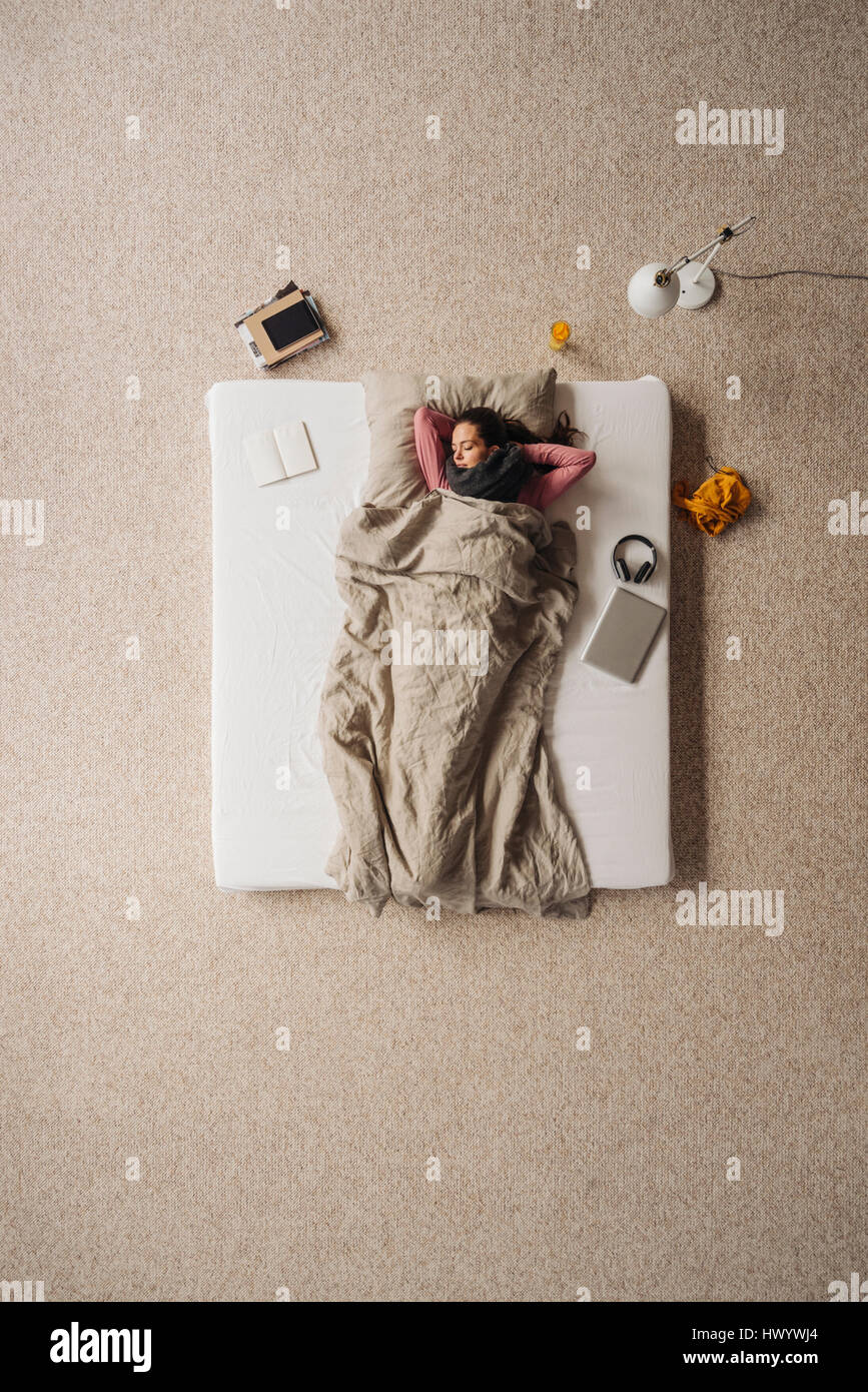 Woman lying in bed, top view Stock Photo - Alamy