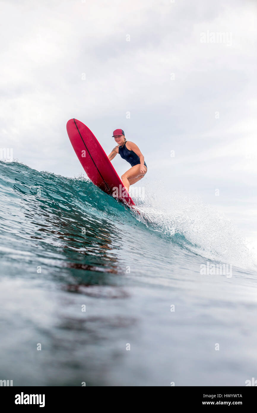 Indonesia, Java, woman surfing Stock Photo - Alamy
