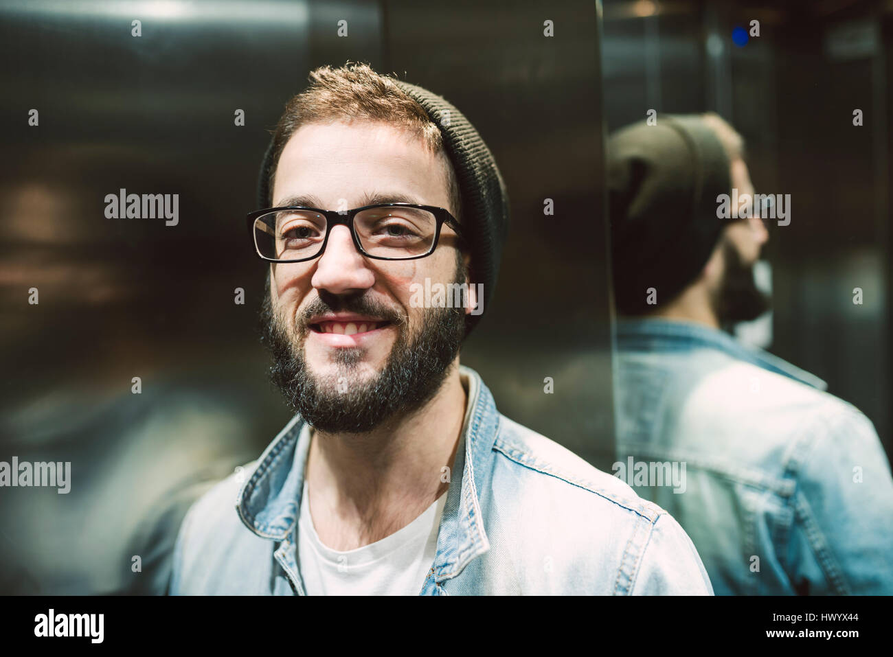 Man in a elevator with camera hi-res stock photography and images - Alamy