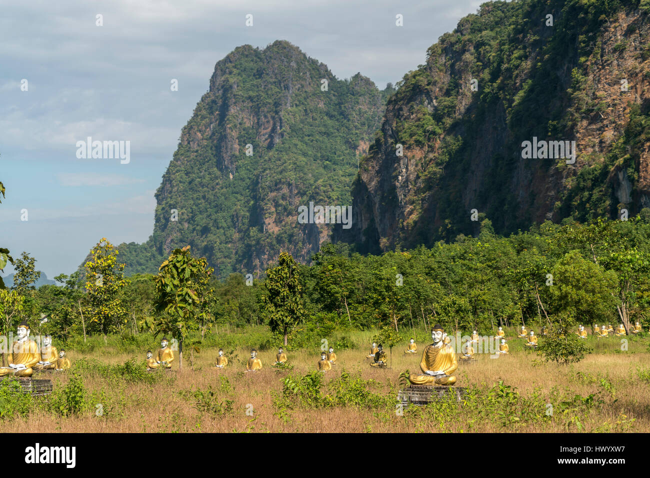 Myanmar, Hpa-an, Landscape with rock formations and field of Buddhas ...