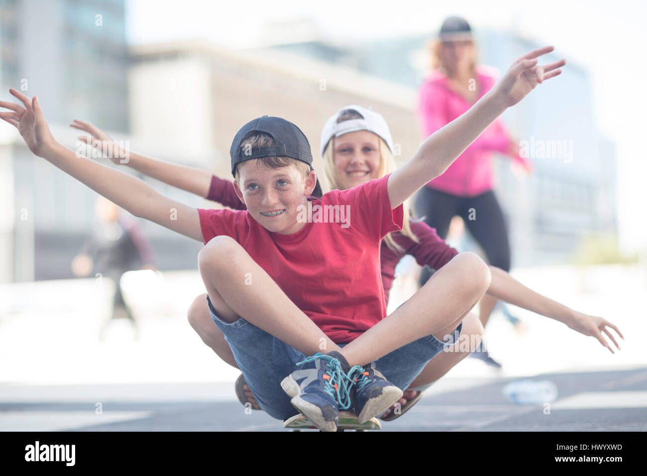 Kids skateboarding in the street Stock Photo - Alamy