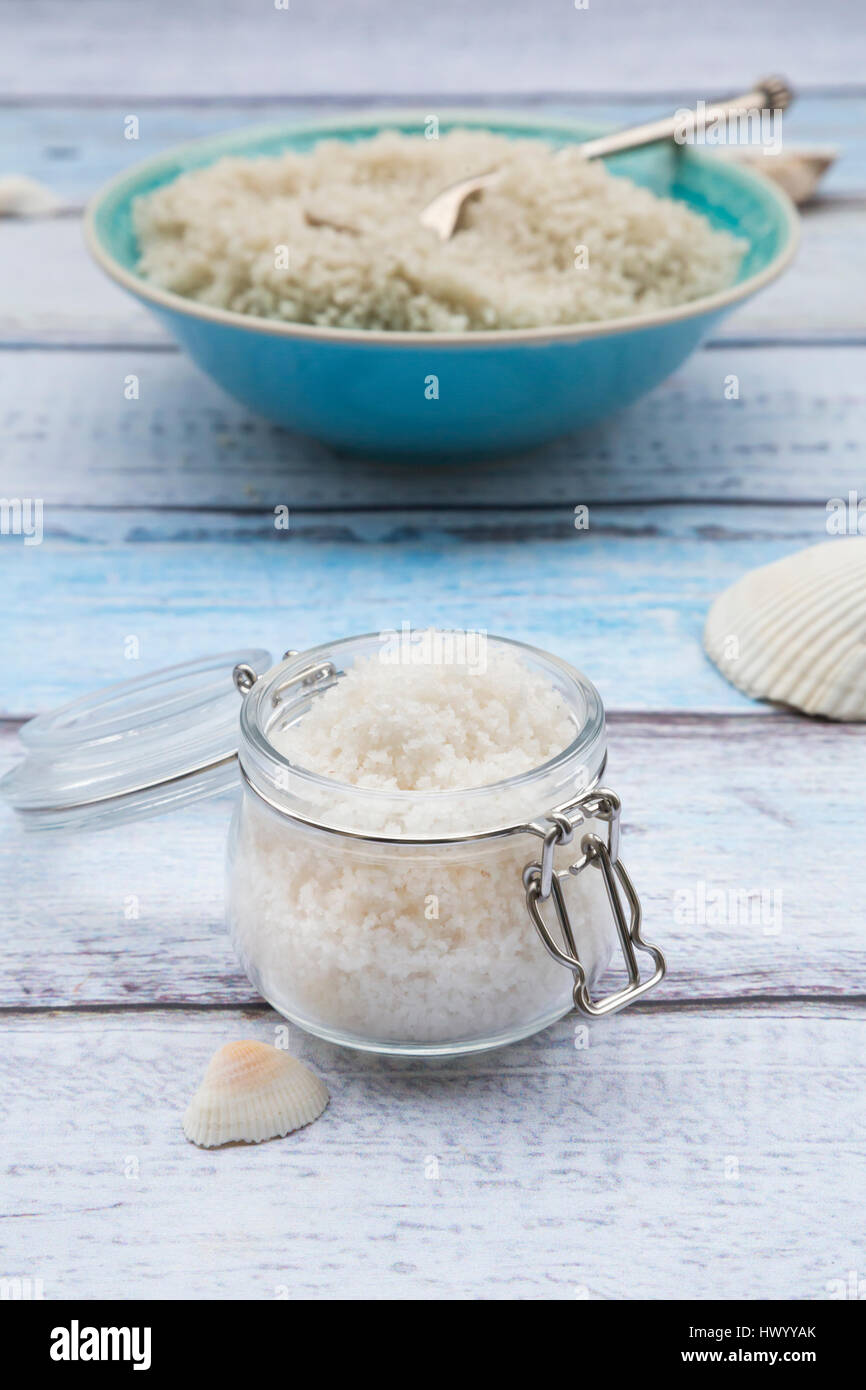 Preserving jar of Guerande sea salt and seashells on wood Stock Photo ...