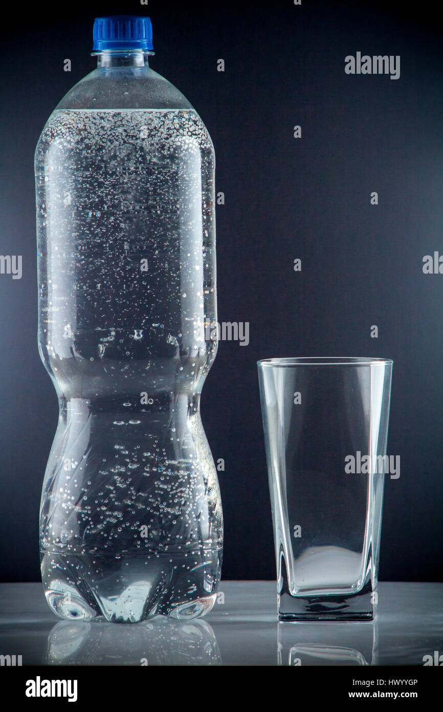 bottle of clear drinking cold mineral water with gas in isolation on ...