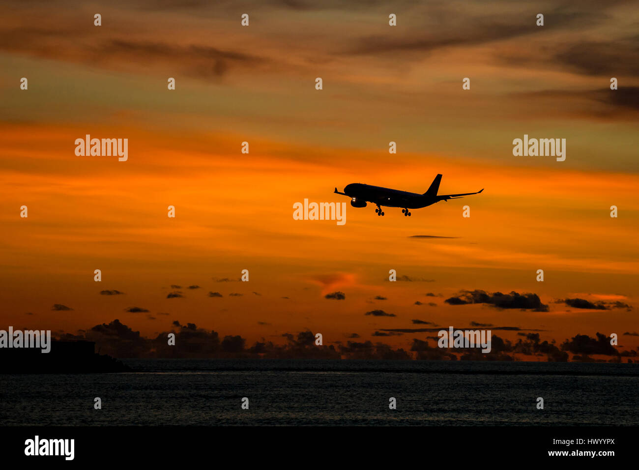 Airplane In Sky Sunset Over Ocean High Resolution Stock Photography and ...