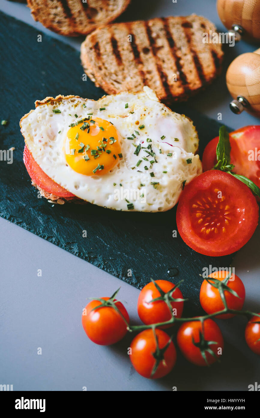 Breakfast with eggs, tosst and tomatoes Stock Photo - Alamy