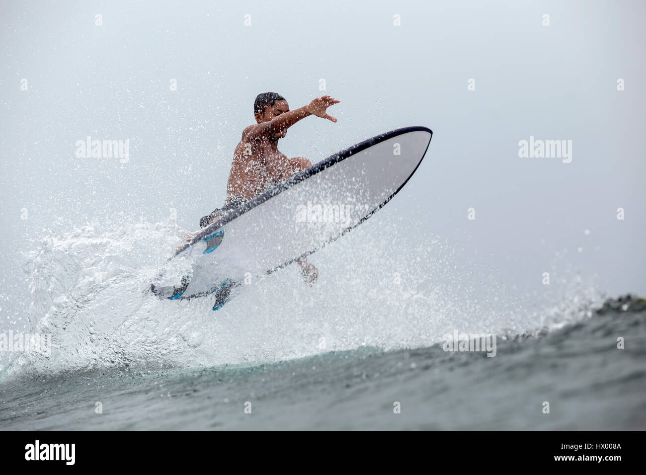 Indonesia, Java, man surfing Stock Photo - Alamy