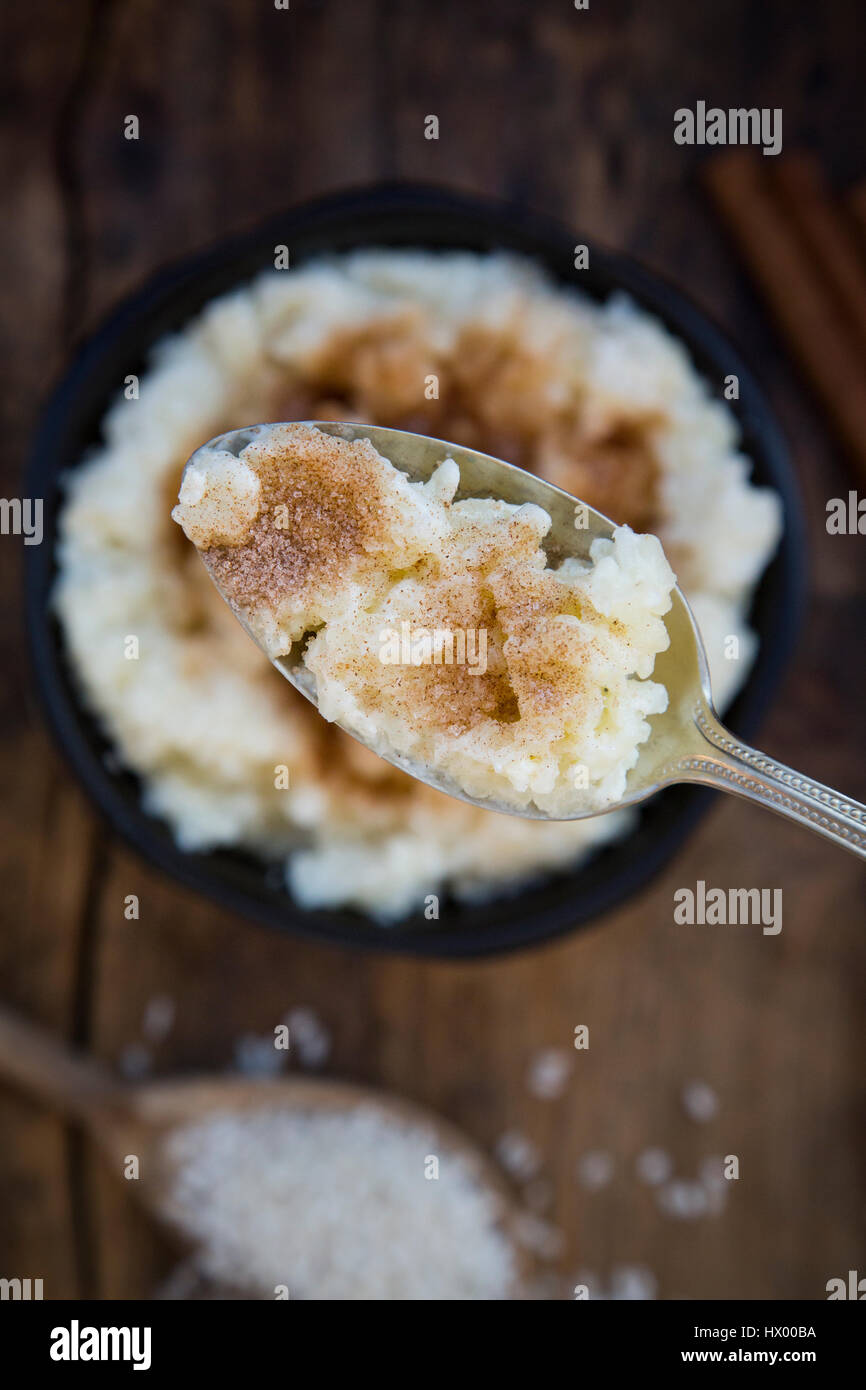 Spoon of milk rice pudding with cinnamon Stock Photo - Alamy