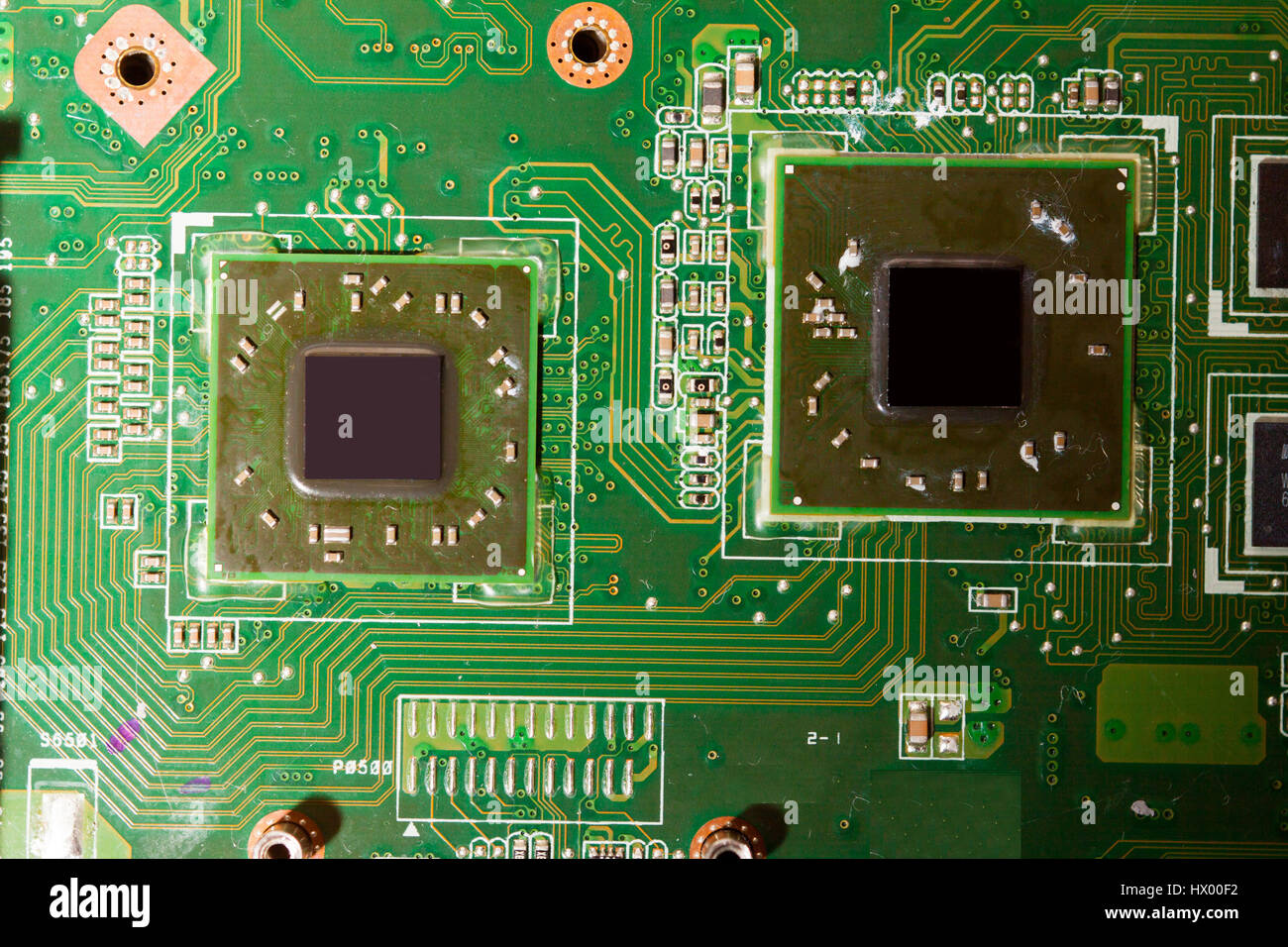 Close-up of electronic circuit board with chips and processors ...