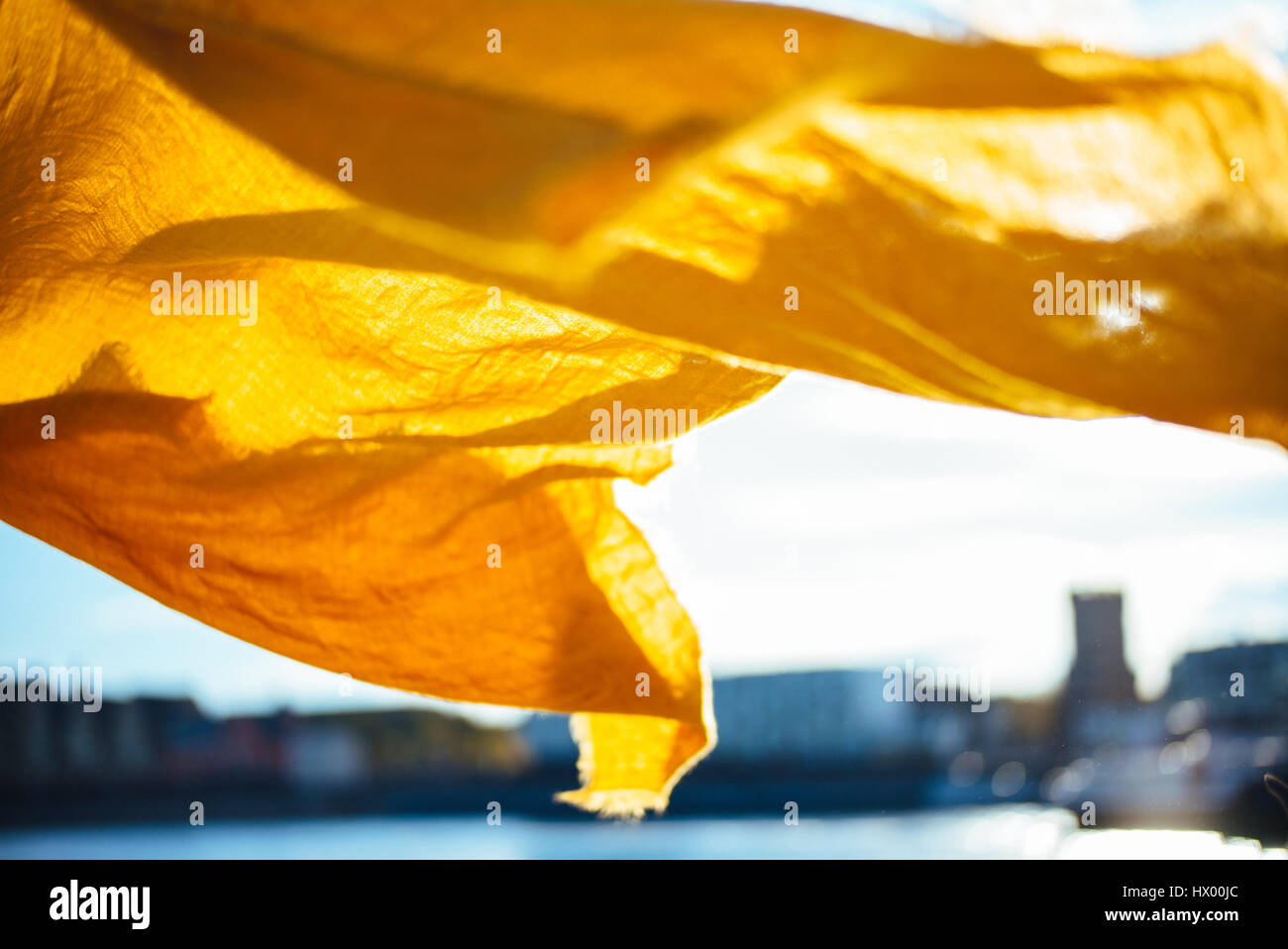 Yellow cloth blowing in the wind Stock Photo - Alamy