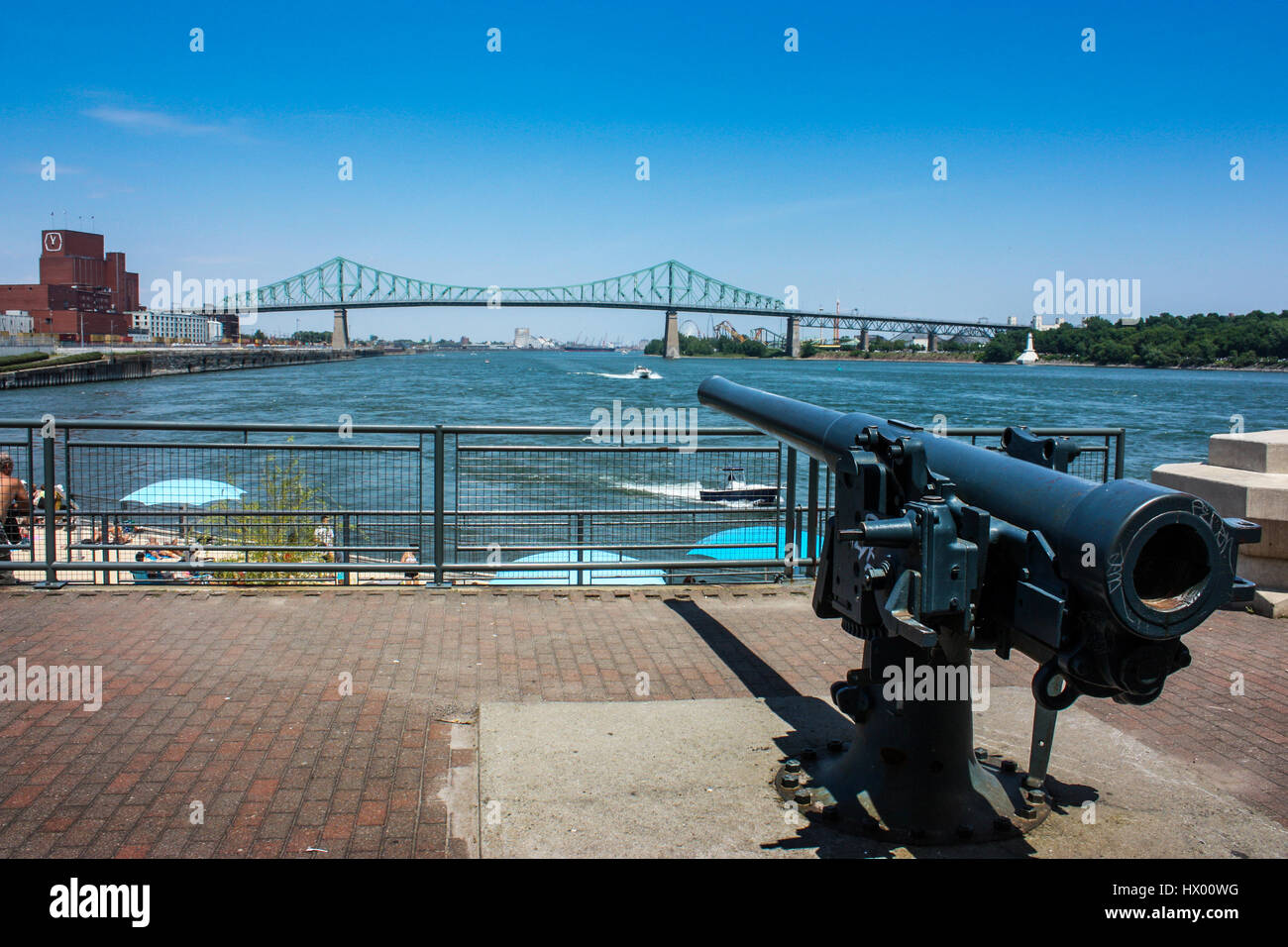 old gun pointing at the Jacques-Cartier bridge in old Montreal, Quebec ...