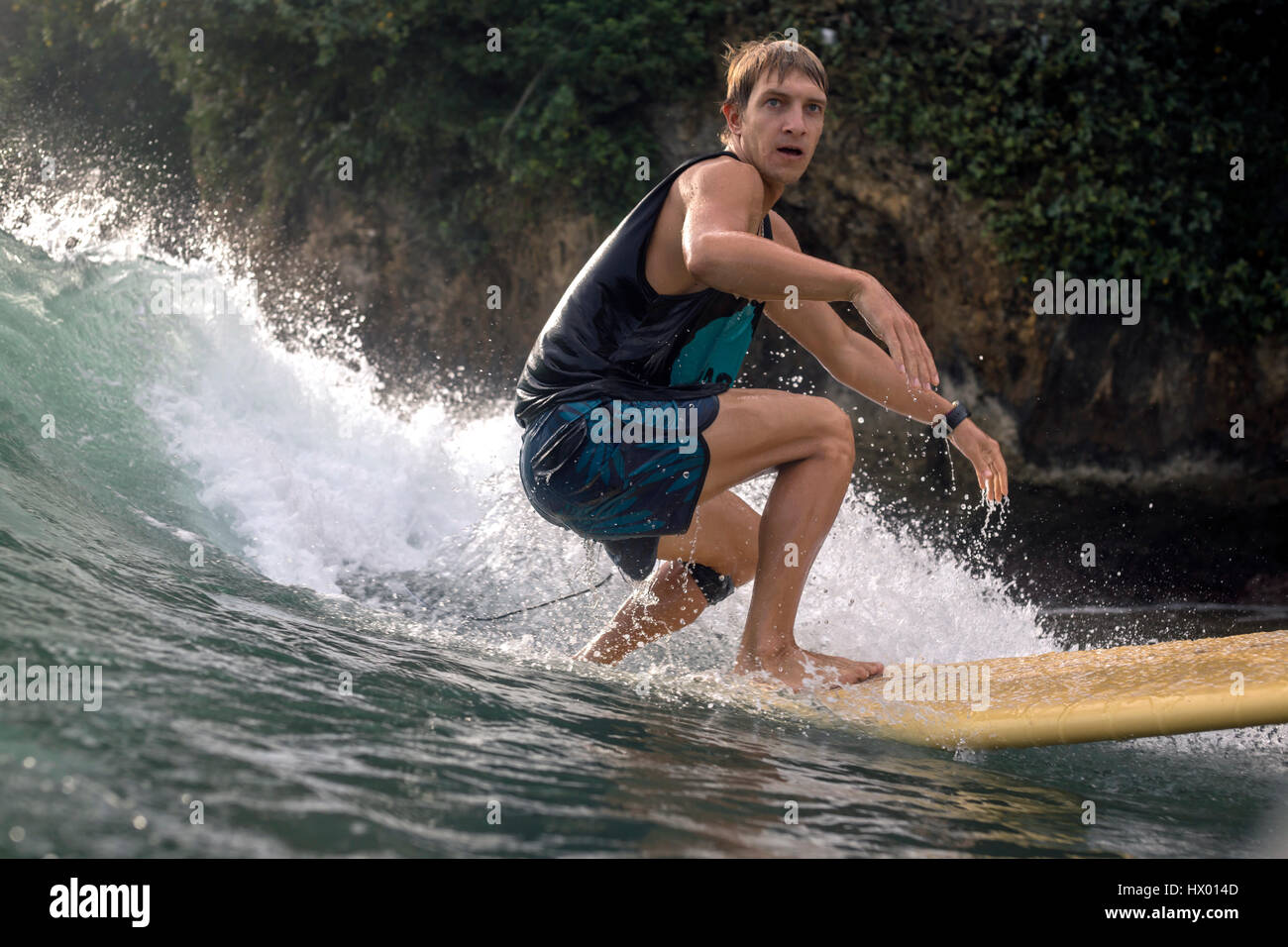 Indonesia, Java, man surfing Stock Photo - Alamy
