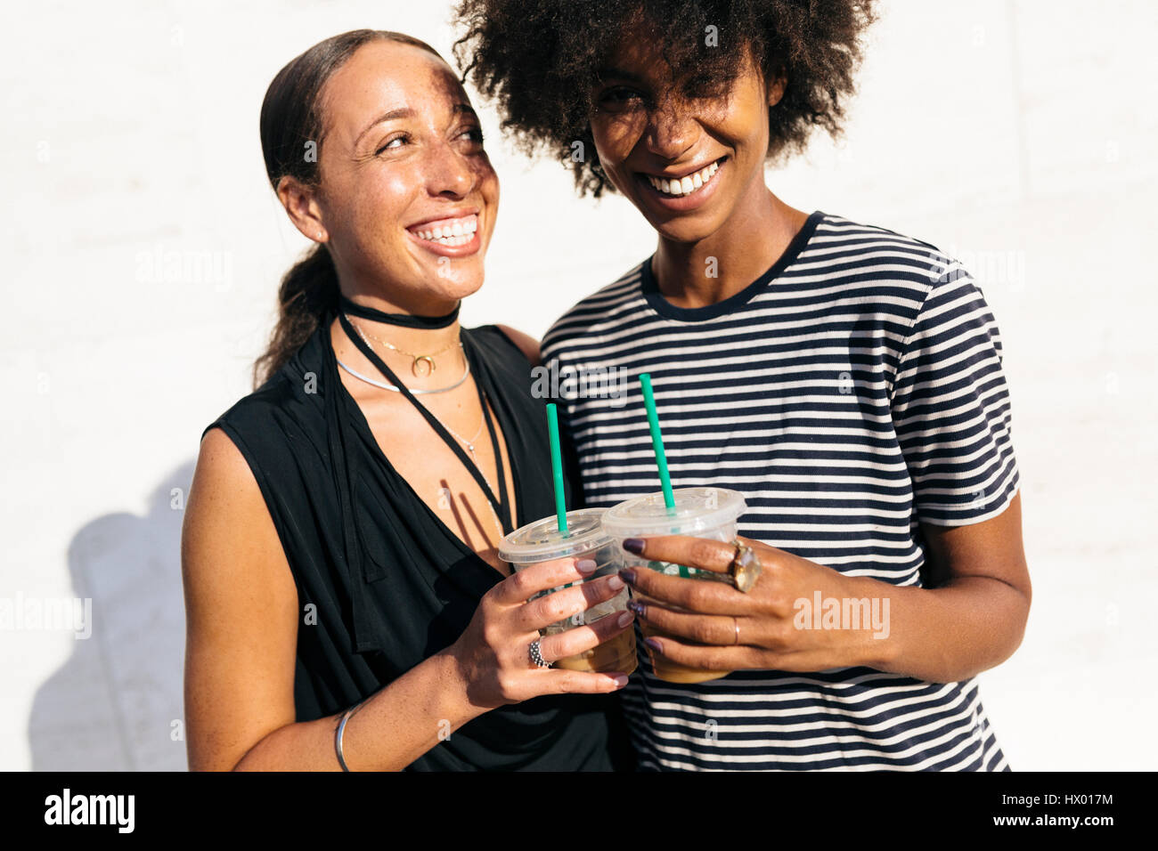 Two laughing women toasting hi-res stock photography and images - Alamy