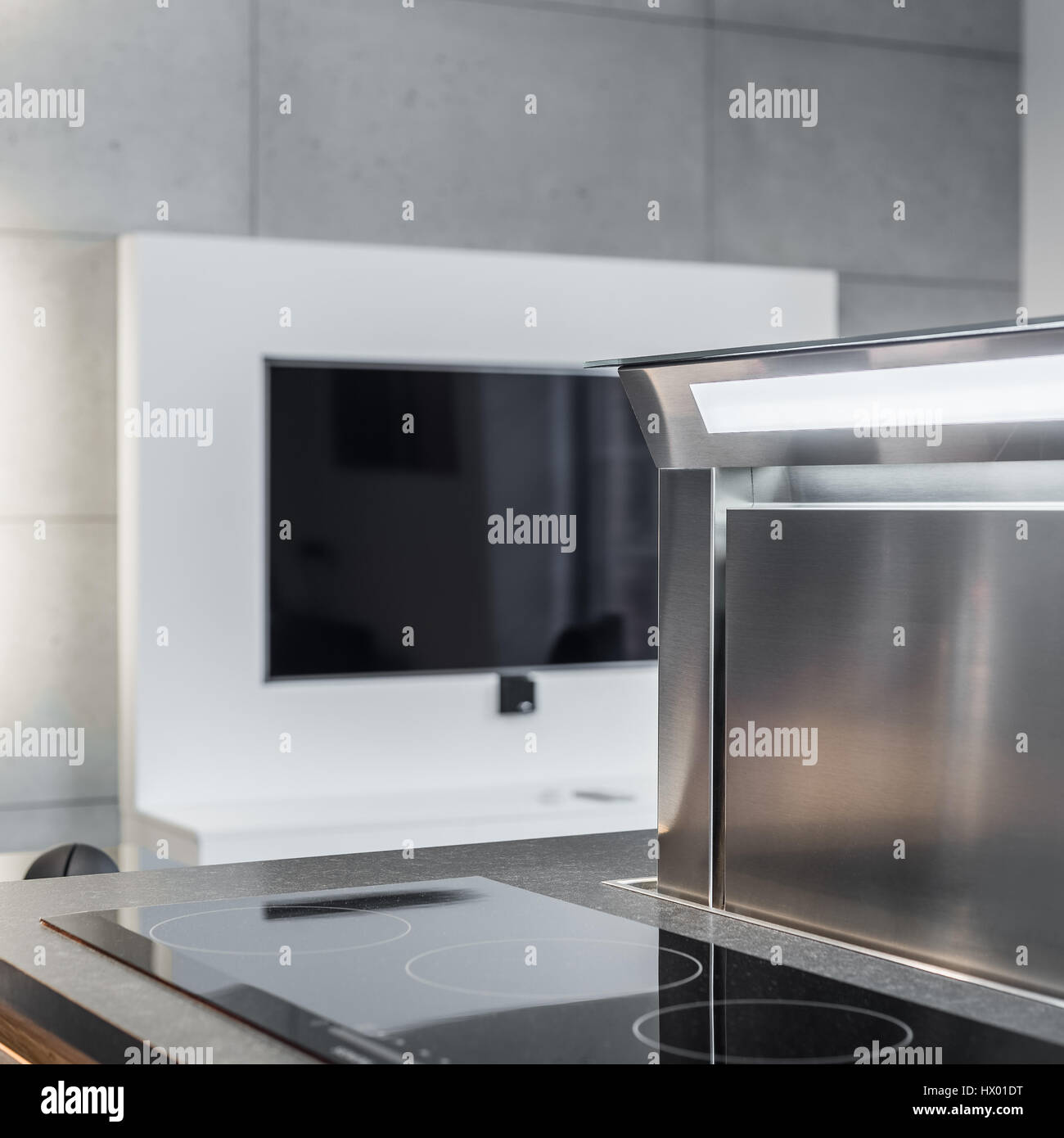 Close up on modern and stylish induction hob with elegant hood in ...