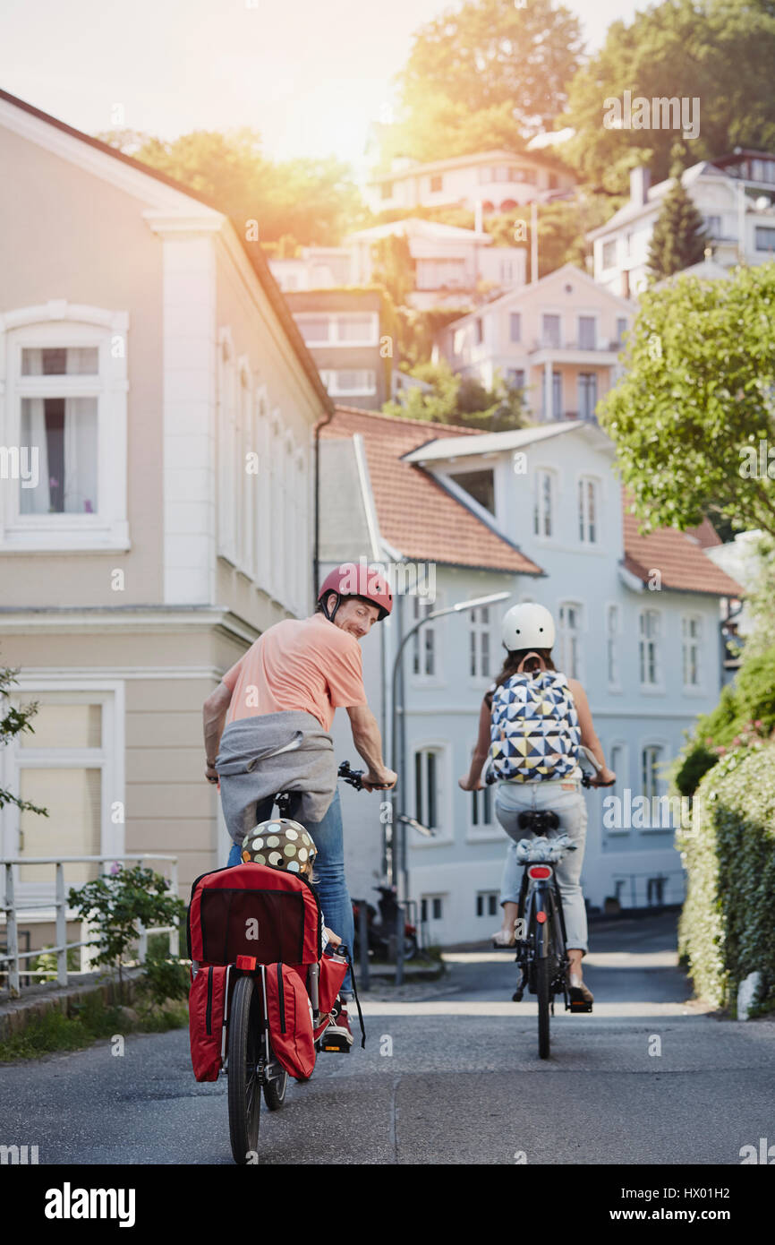 Germany, Hamburg, Blankenese, family riding e-bikes Stock Photo - Alamy