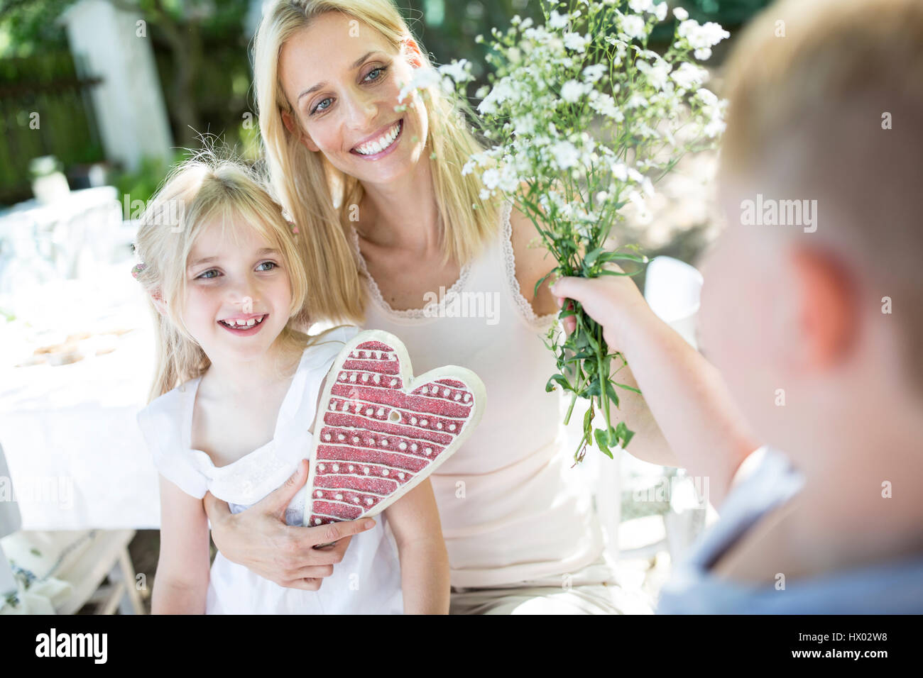 Happy mother receiving Mother's Day gifts Stock Photo - Alamy