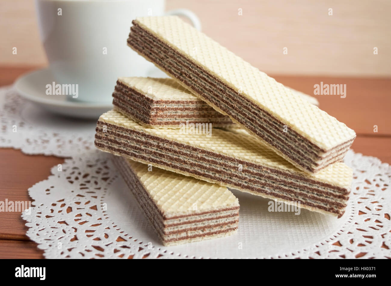 Crunchy chocolate wafers on white napkin and cup of tea Stock Photo - Alamy